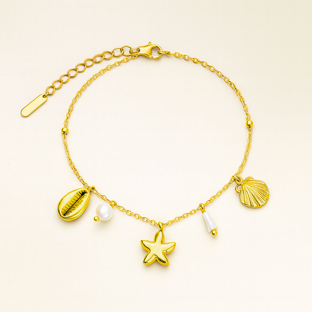 Amoura Dainty Gold Ocean Charms Bracelet | Mesmerize